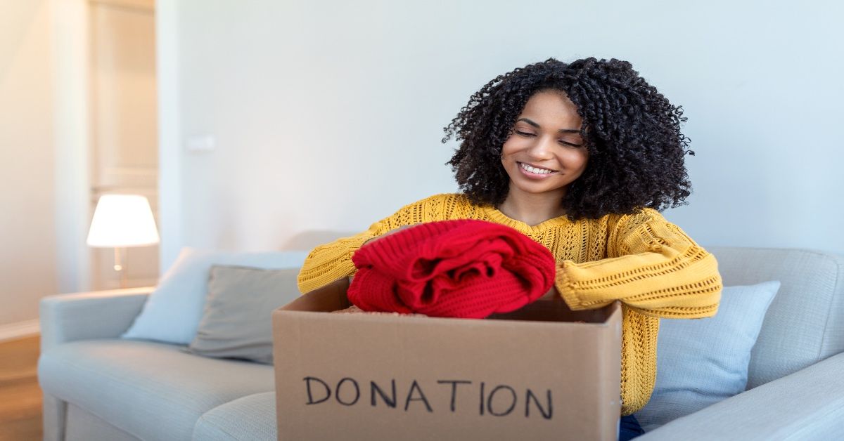 black-woman-donating-clothes - MEFeater
